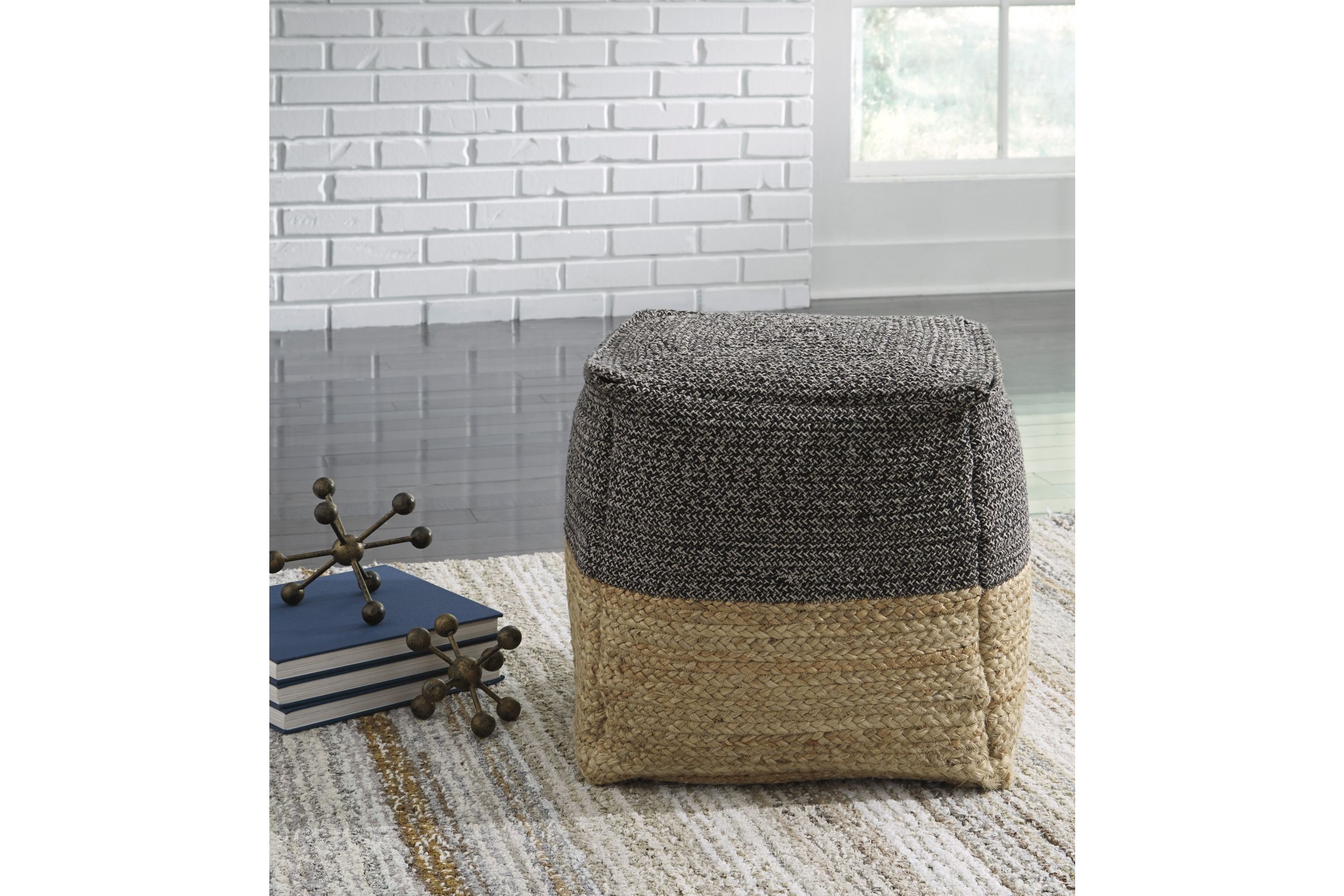 Sweed Natural and Black Valley Pouf by Ashley at Gardner-White
